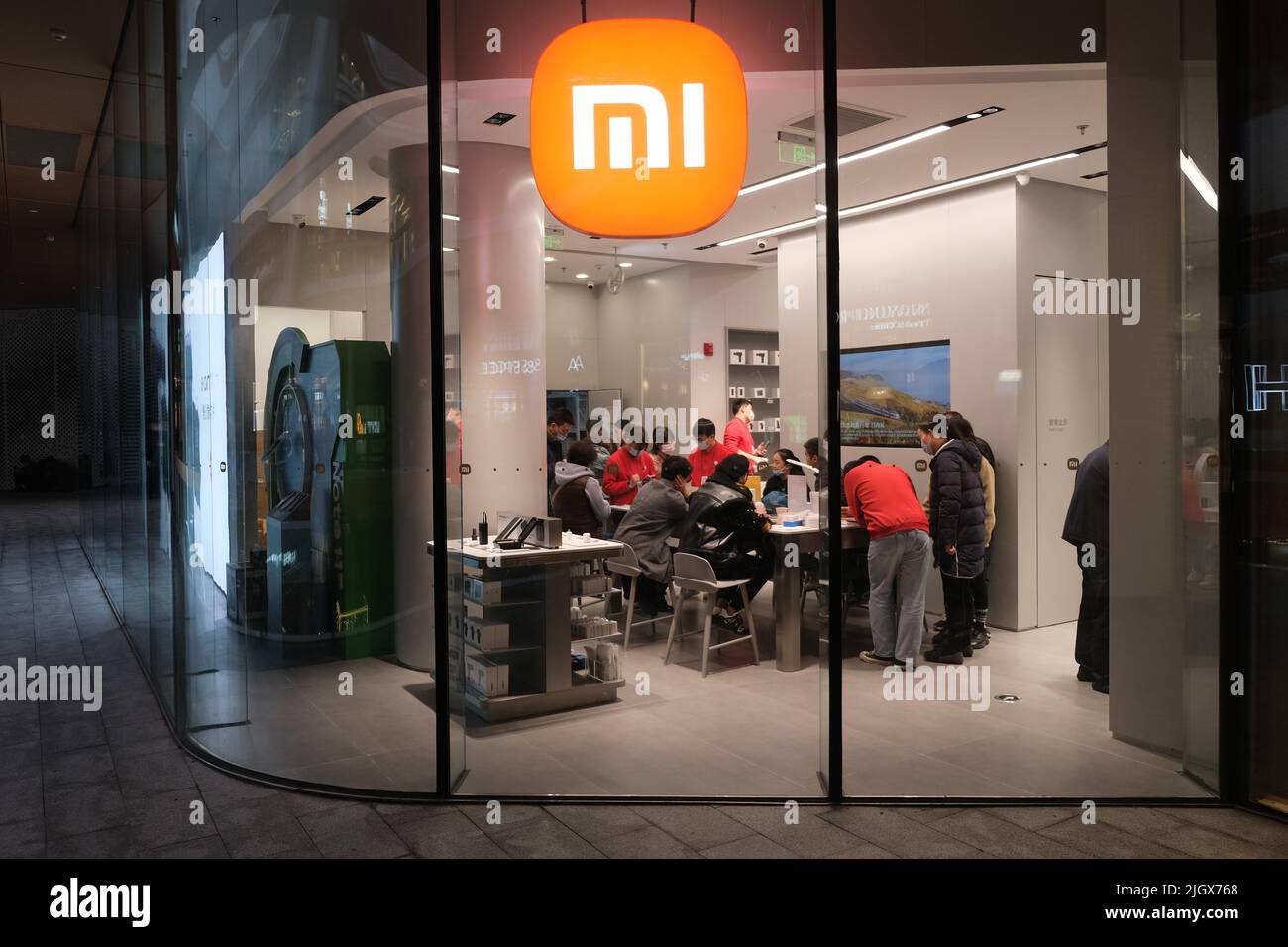 Shanghai,China-Dec.12th 2021: exterior of Xiaomi electronic store and many Chinese customers ...