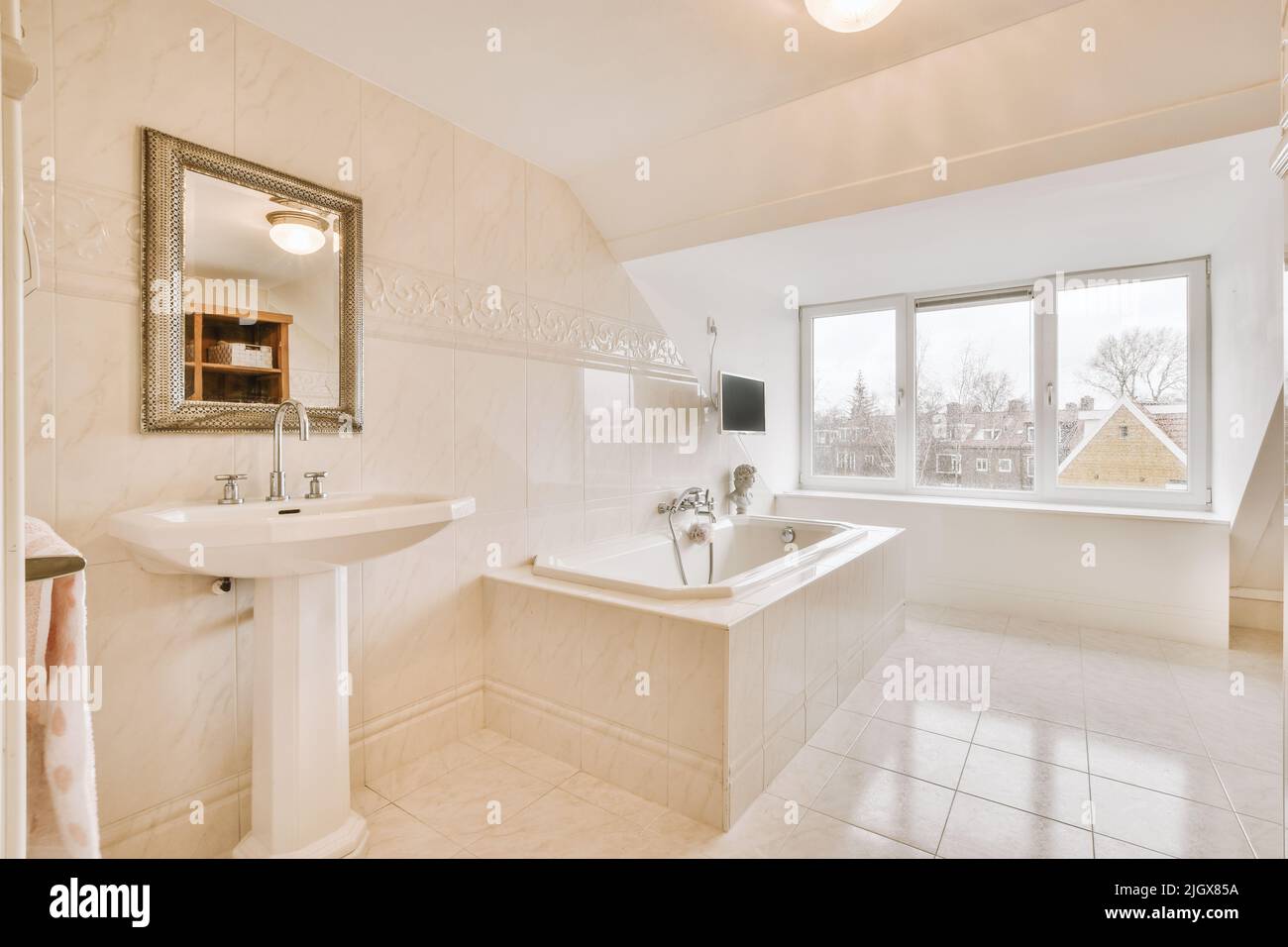 Sinks with mirrors and clean bathtub in modern bathroom with white ... Sinks with mirrors and clean bathtub in modern bathroom with white ...