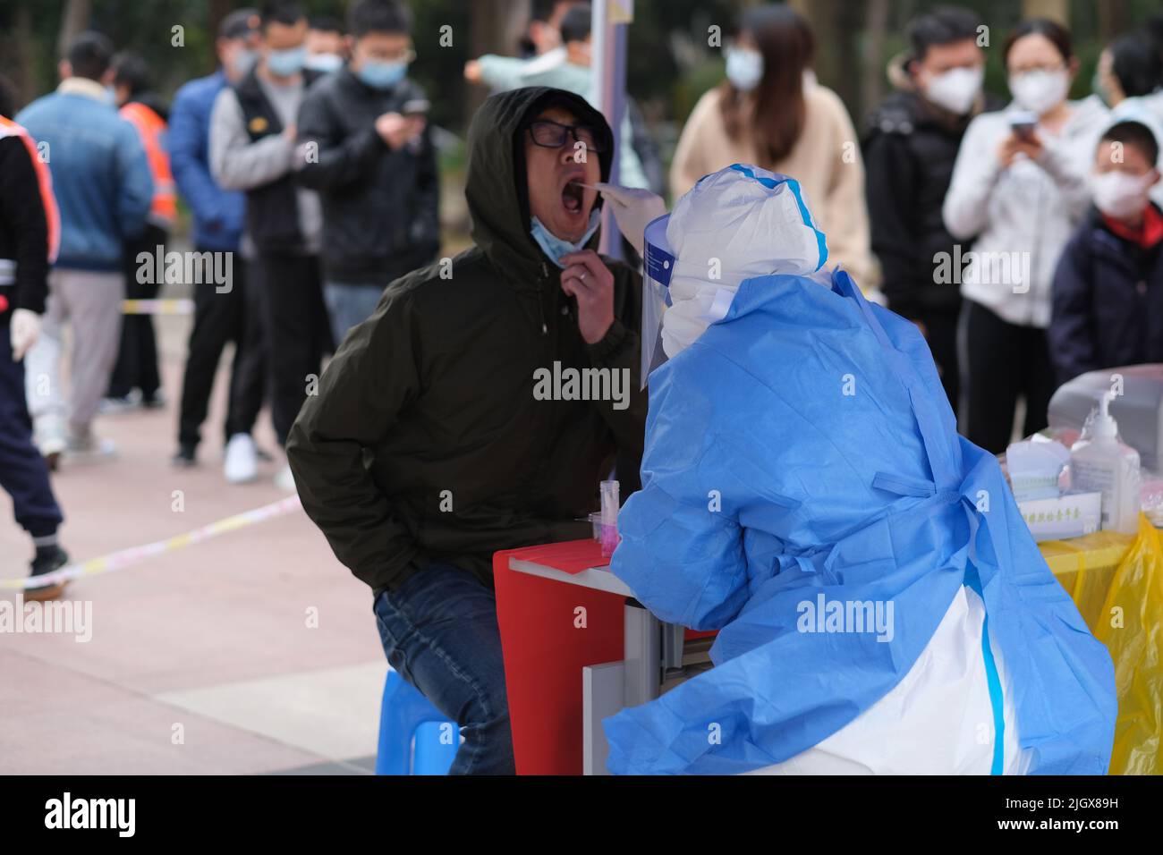 Shanghai,China-March 19th 2022: Chinese people lining up to receive ...