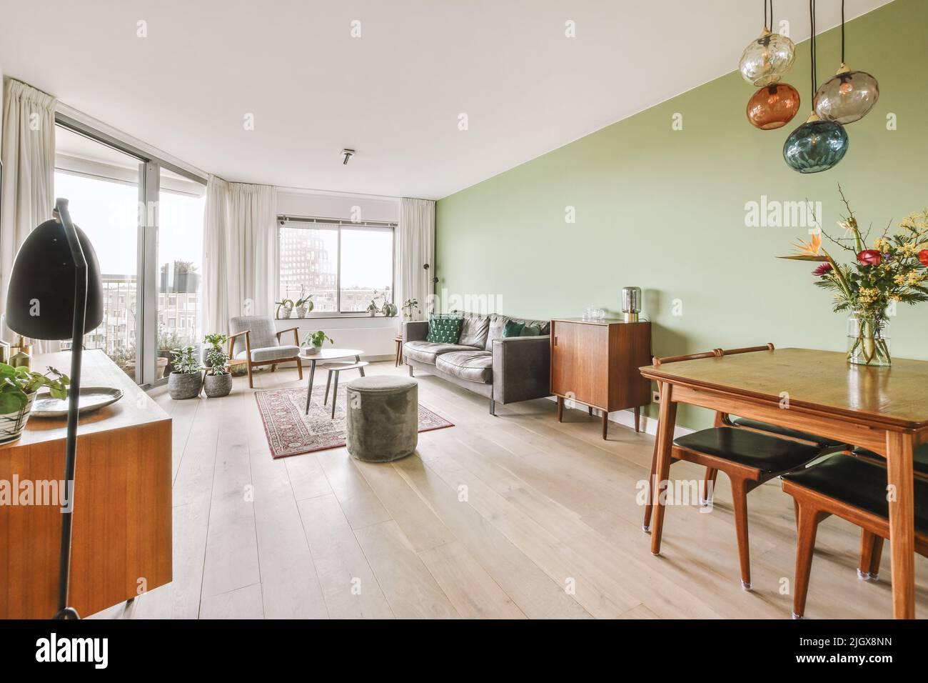 Stylish interior design of living room with light furniture and soft ...