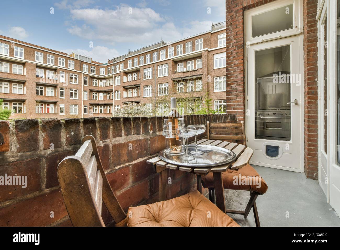 Sitting area in balcony with comfortable furniture around beautiful ...