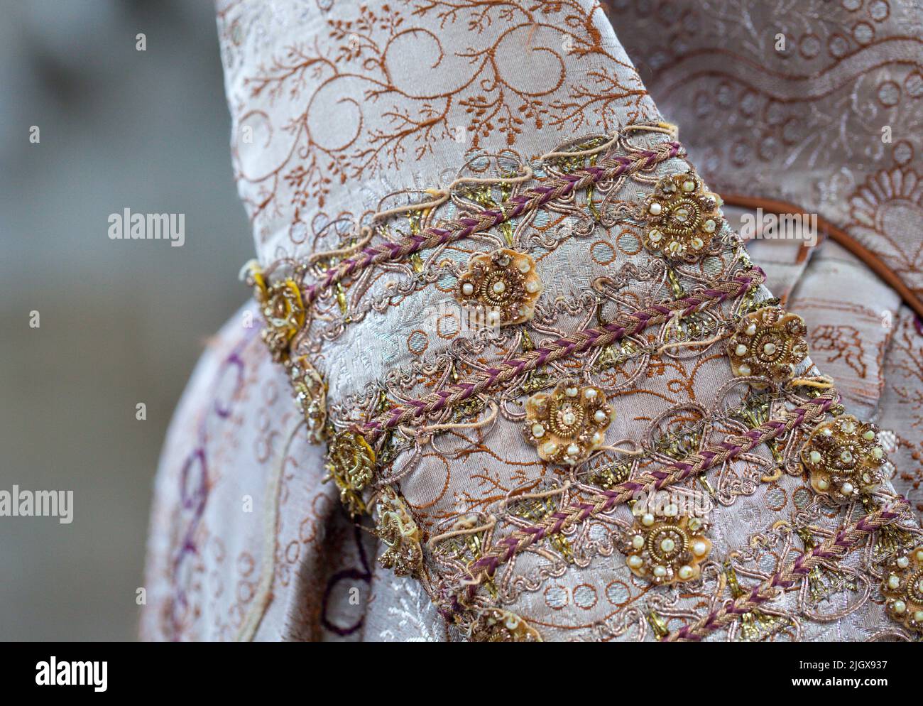 Close-up detail of embroidery and needlework on the arms of a period ...