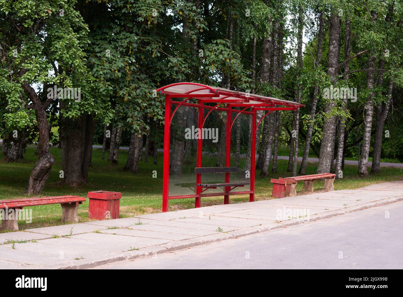 Empty red public transport stop in summer. Self isolation. Bus and ...