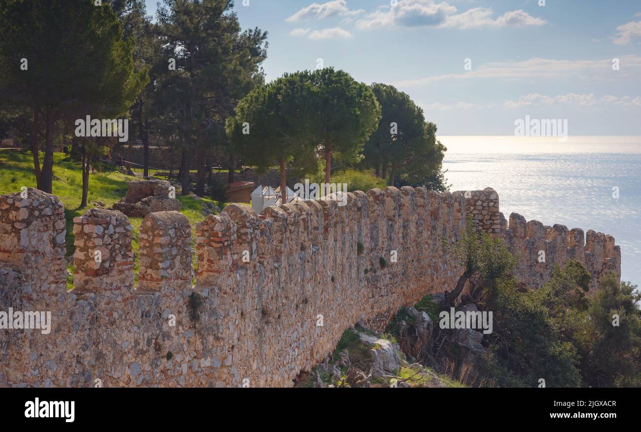 Alanya, turkey, winter walk by mediterranean sea. medieval fortress in ...