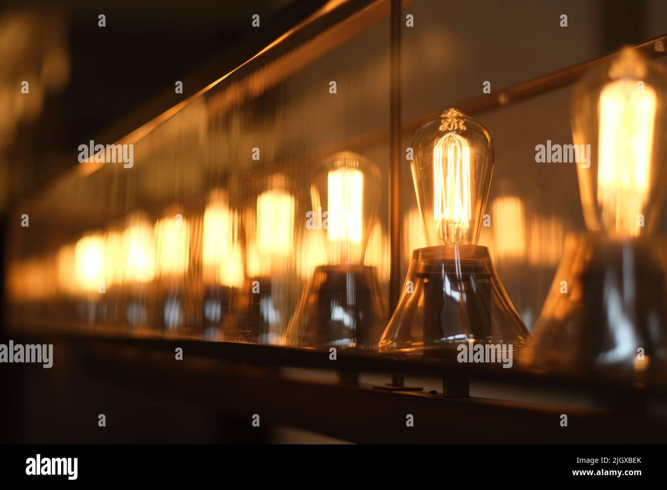 a row of retro light bulbs at night. diminishing perspective Stock ...