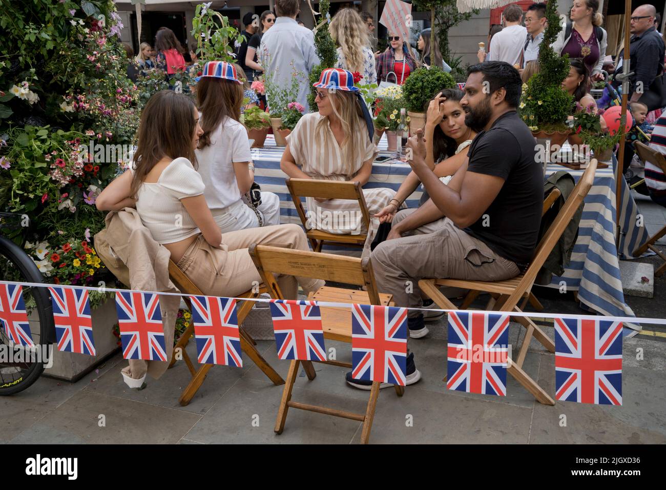Visitors at a street party to commemorate Queen Elizabeth II 70th year ...