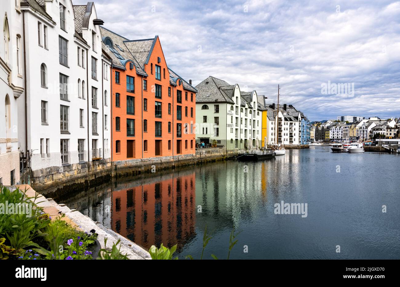 Colourful buildings and reflections around the harbour and canal ...