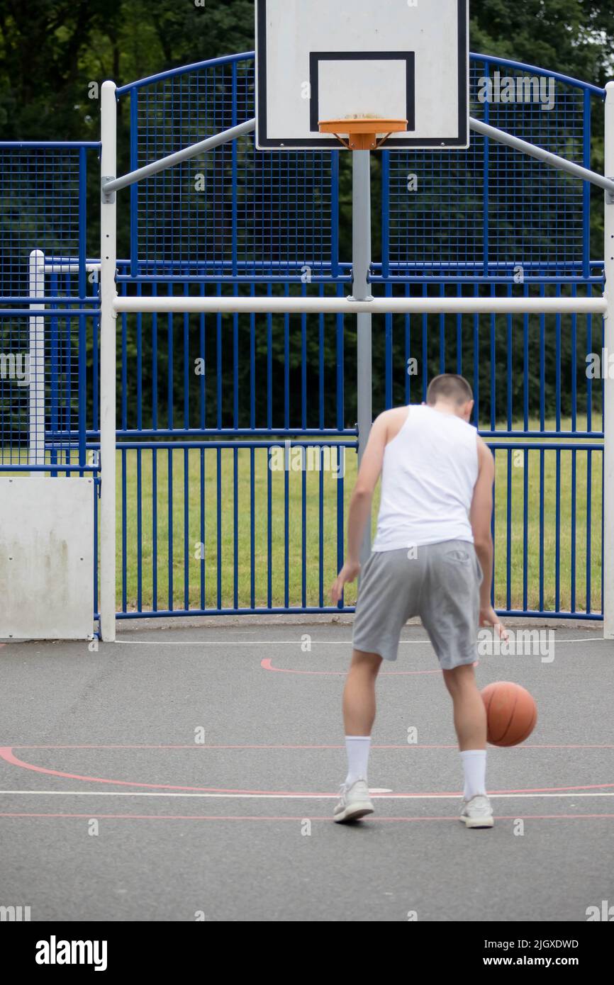 A Nineteen Year Old Teenage Boy Shooting A Hoop in A Basketball Court ...