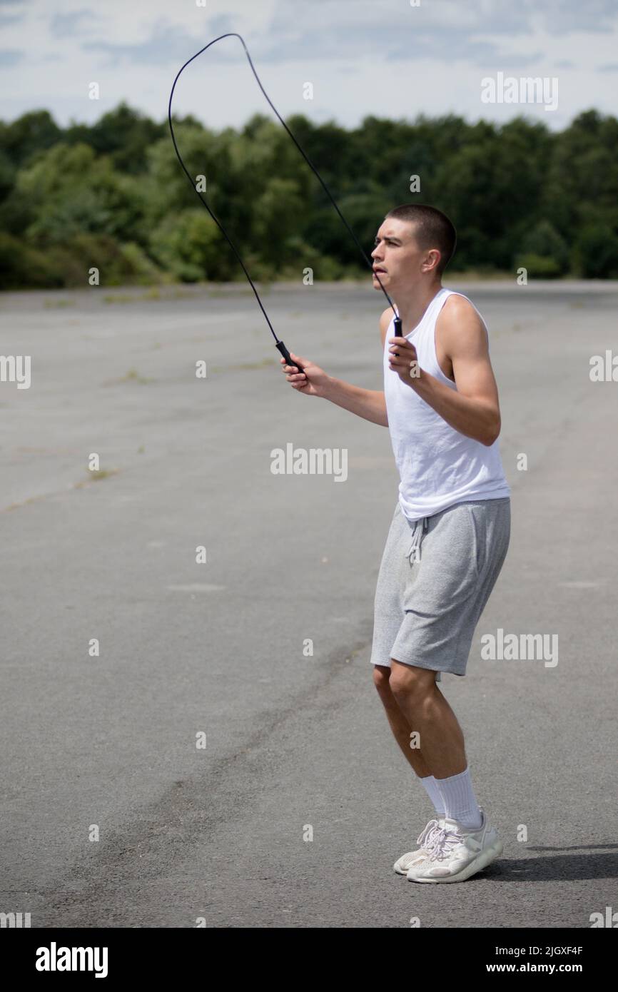 A Nineteen Year Old Teenage Boy Using A Skipping Rope in A Public Park ...