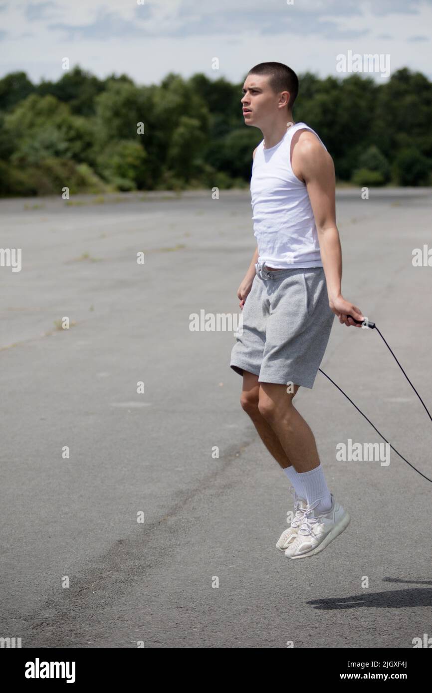 Boy skipping rope hi-res stock photography and images - Alamy