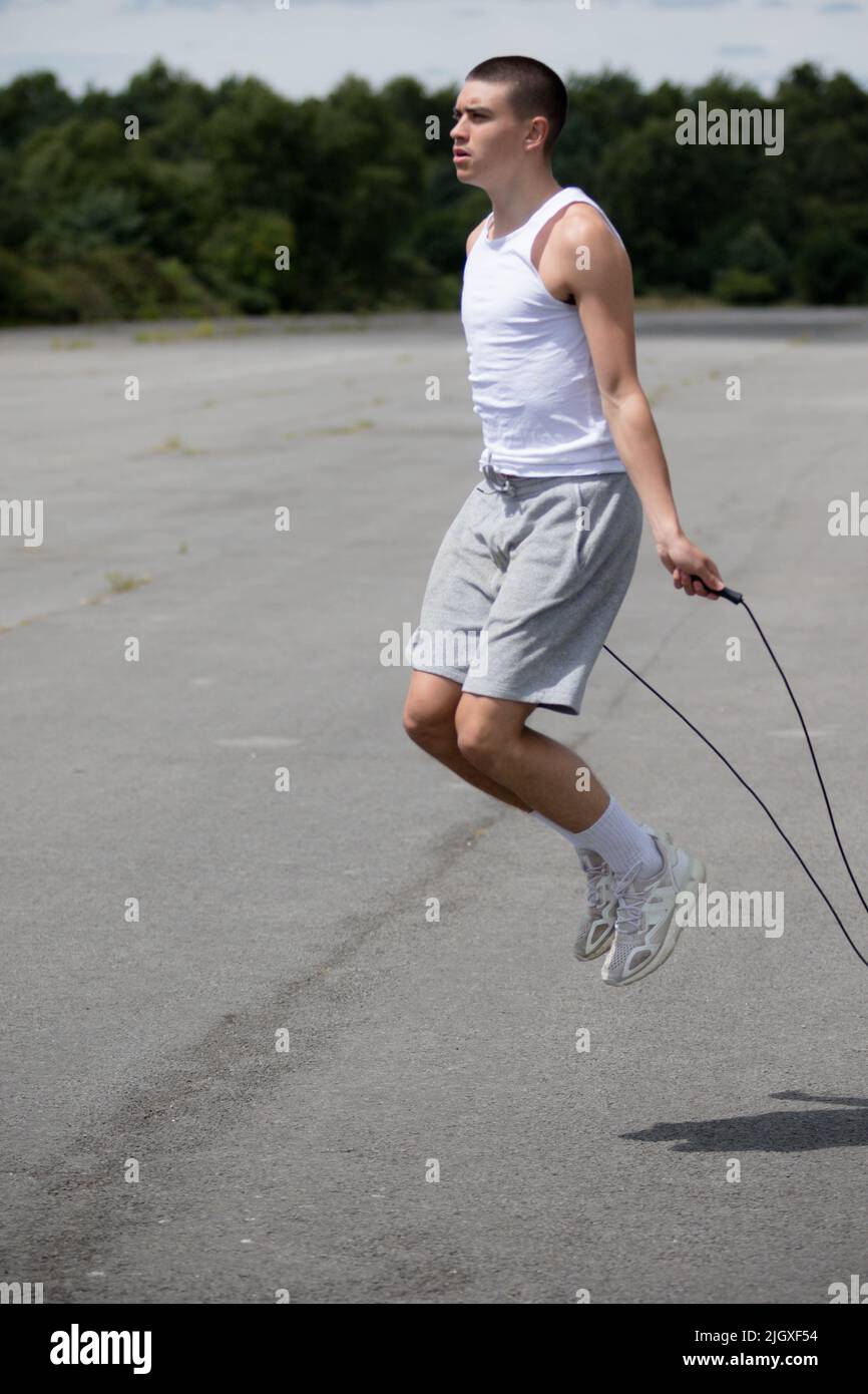 Boy skipping rope hi-res stock photography and images - Alamy