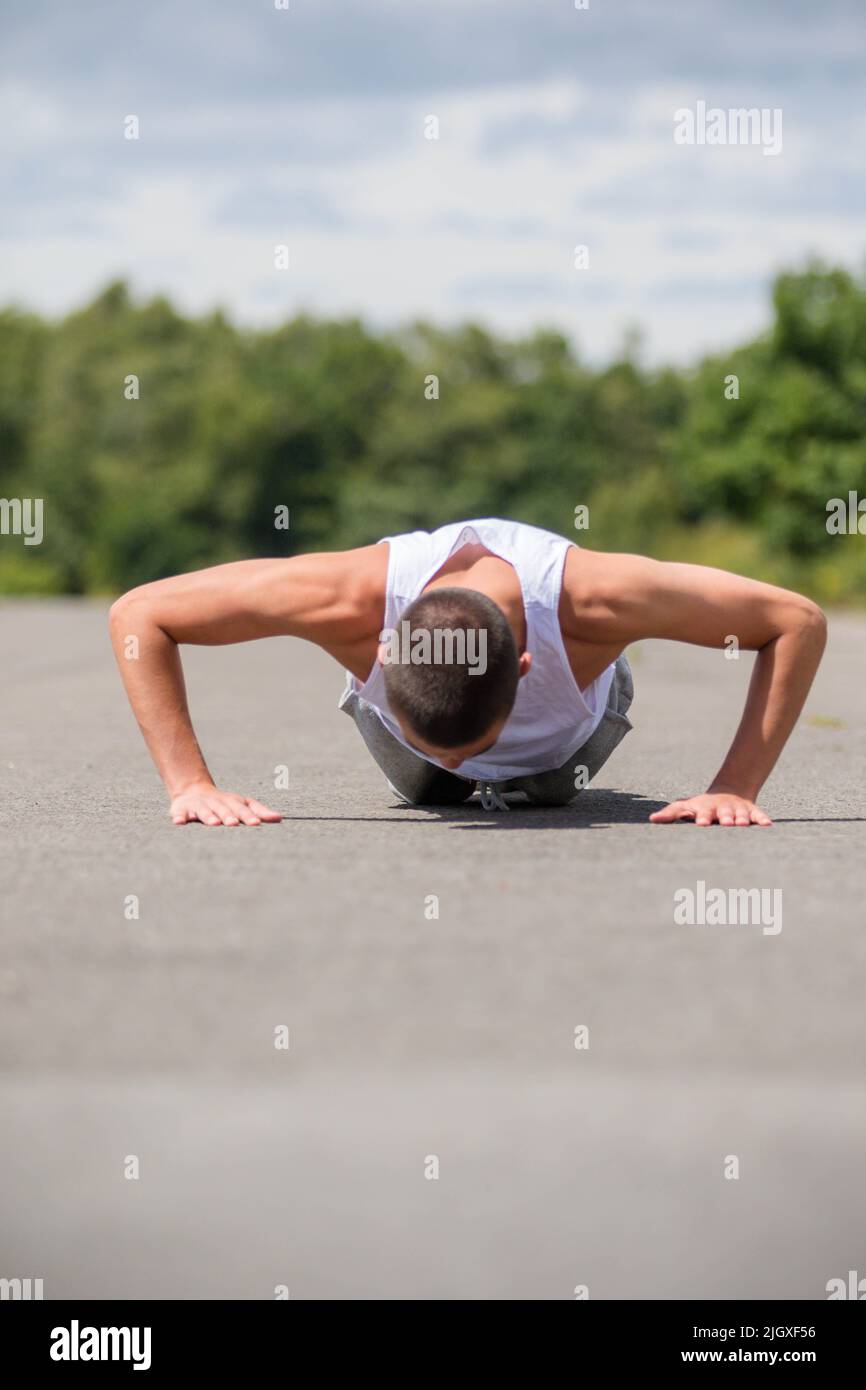 Young boy doing push ups hi-res stock photography and images - Alamy