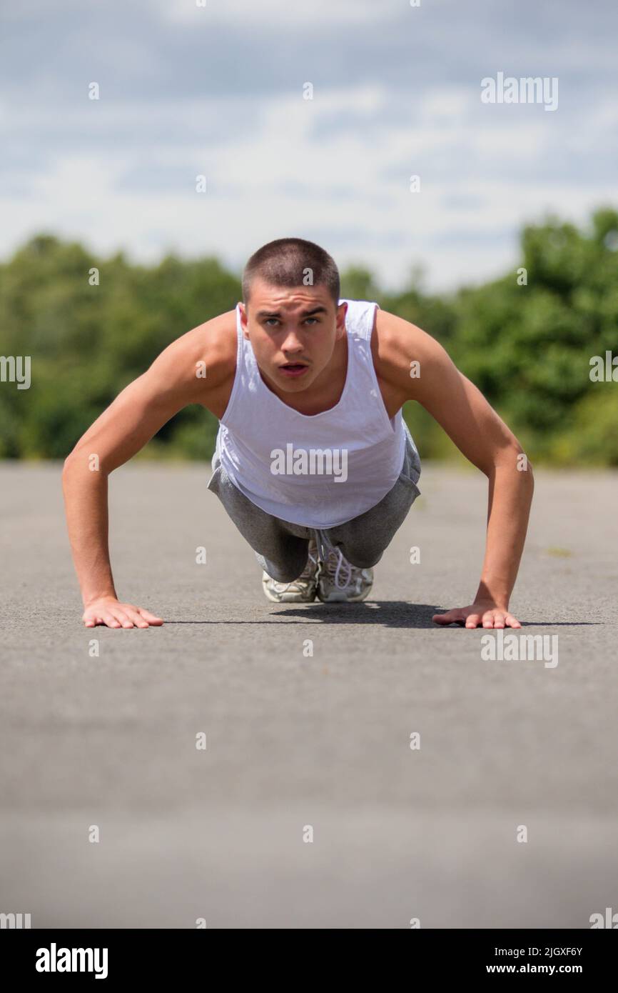 A Nineteen Year Old Teenage Boy Doing Push Ups A Public Park Stock ...