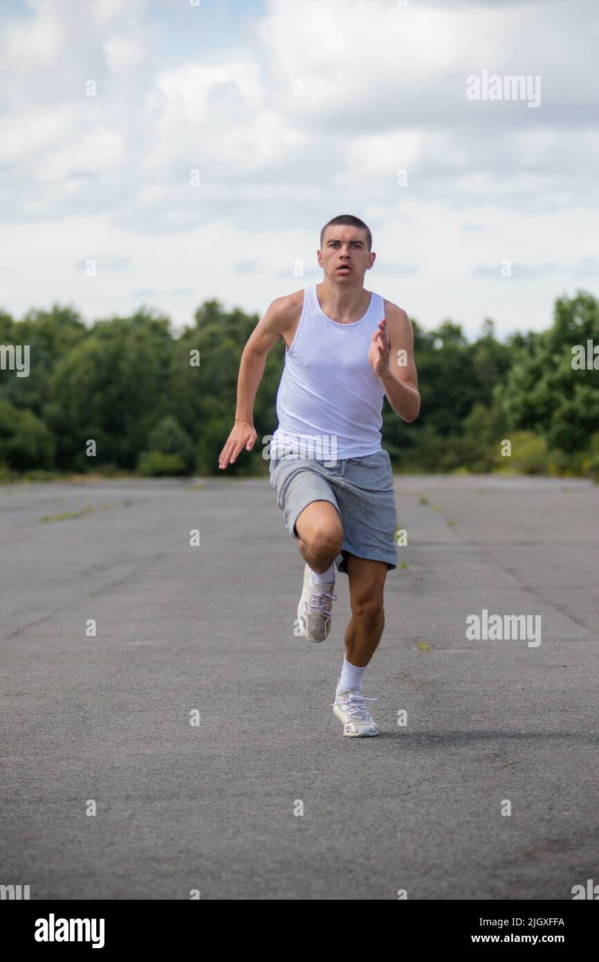 A teenage boy jogging hi-res stock photography and images - Alamy