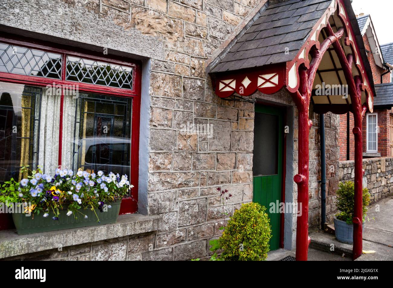 Tree branch columns and carved bargeboards in Virginia, Ireland Stock ...