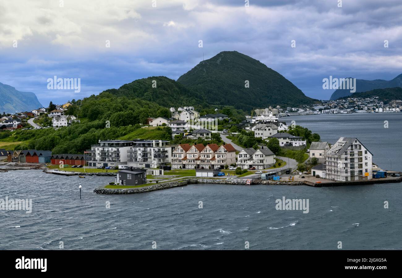 Hillside homes and apartments overlooking the Port of Alesund Norway ...