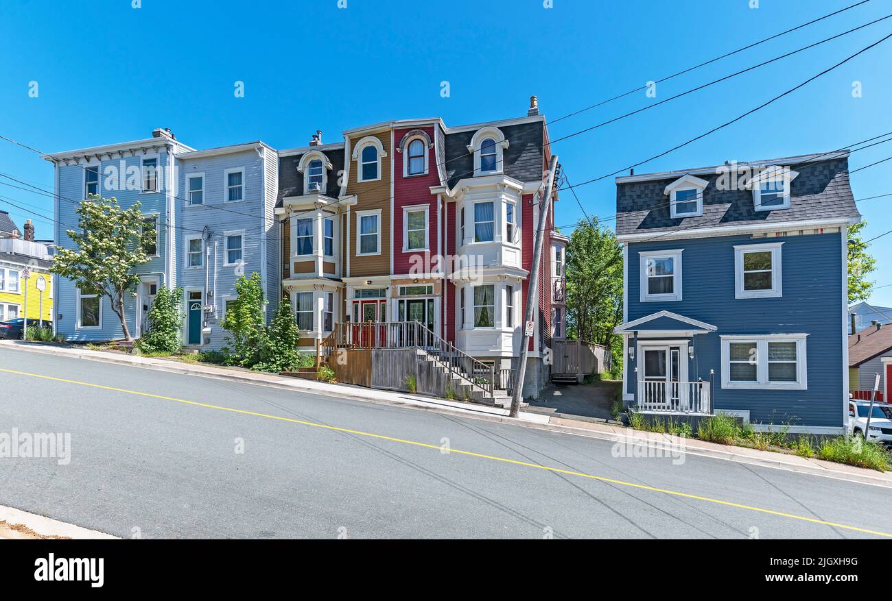 A group of colorful hillside houses in downtown Stock Photo - Alamy