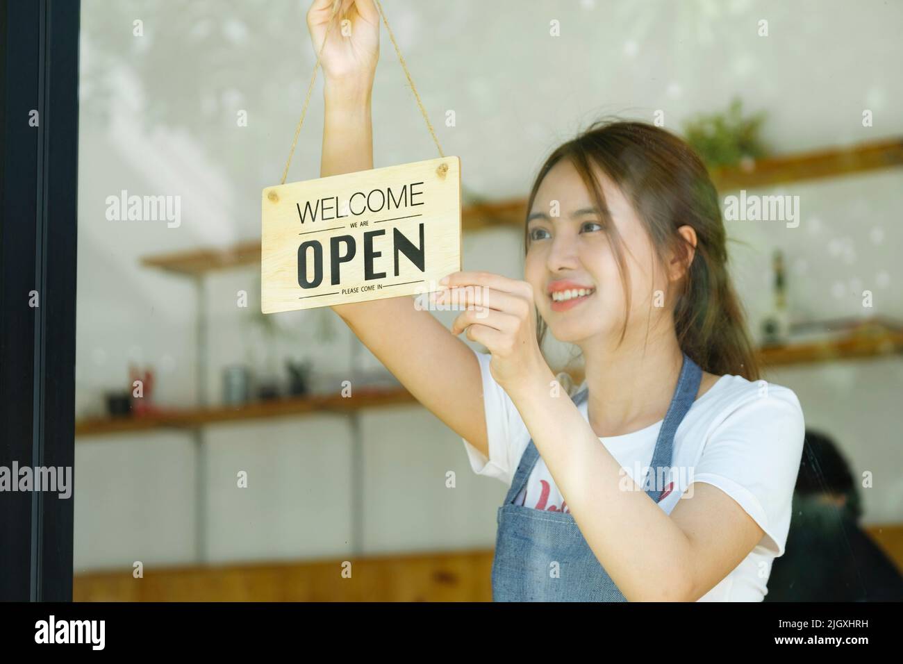 Young business owner open the coffee shop Stock Photo - Alamy