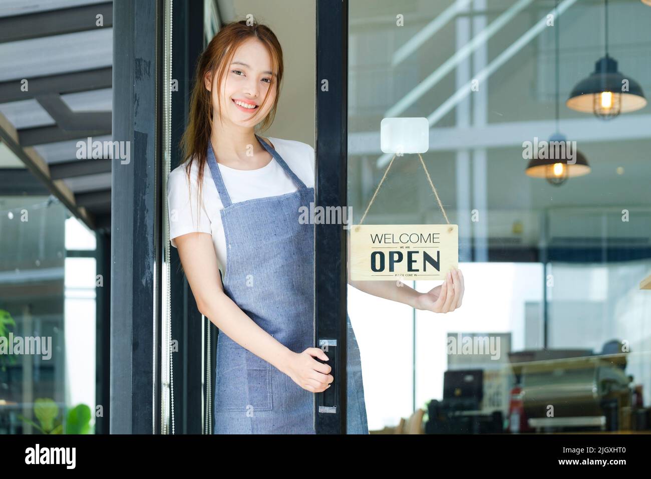 Young business owner open the coffee shop Stock Photo - Alamy