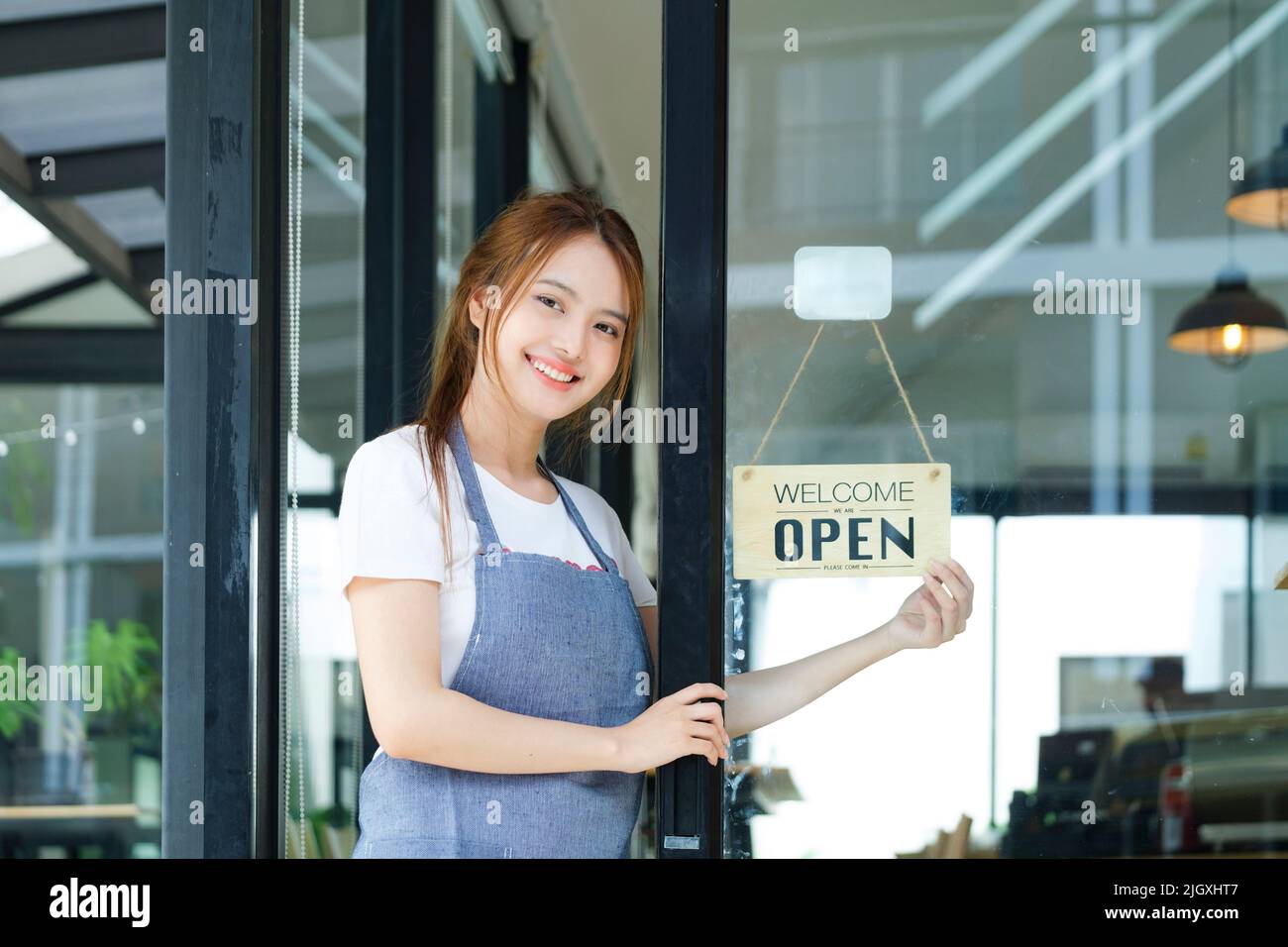 Young business owner open the coffee shop Stock Photo - Alamy