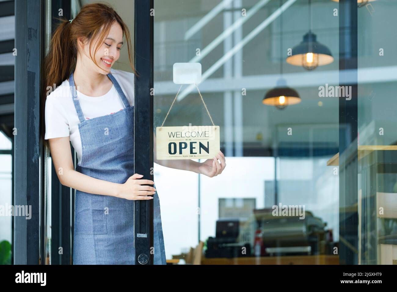 Young business owner open the coffee shop Stock Photo - Alamy
