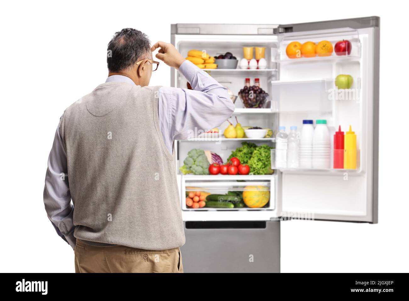 Rear view shot of a mature man looking at an open fridge and thinking ...