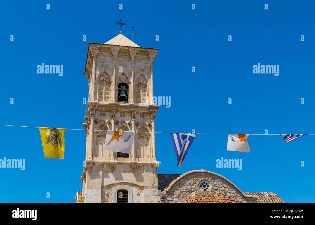 A greek and Cyprus flag in front of St. Lazarus Church Stock Photo - Alamy