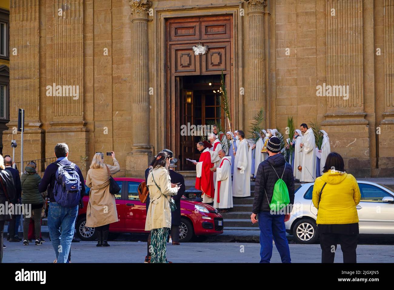 Priests and other robed, religious persons, gather for a Palm Sunday ...