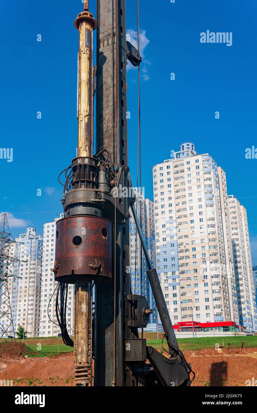 machine for drilling deep piles against the backdrop of residential ...