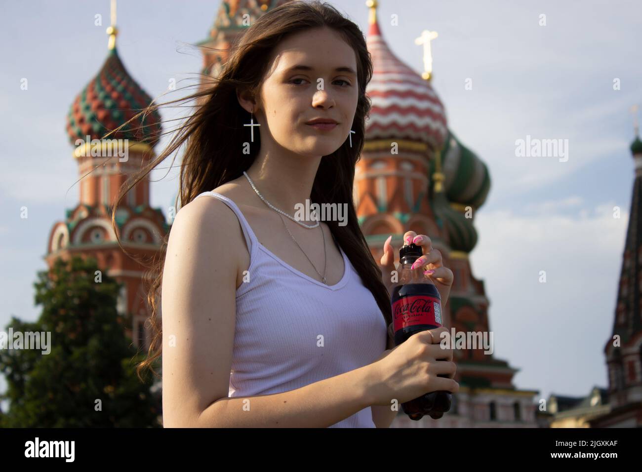 Moscow, Russia. 11th July, 2022. A Russian girl holds a bottle of Coca ...