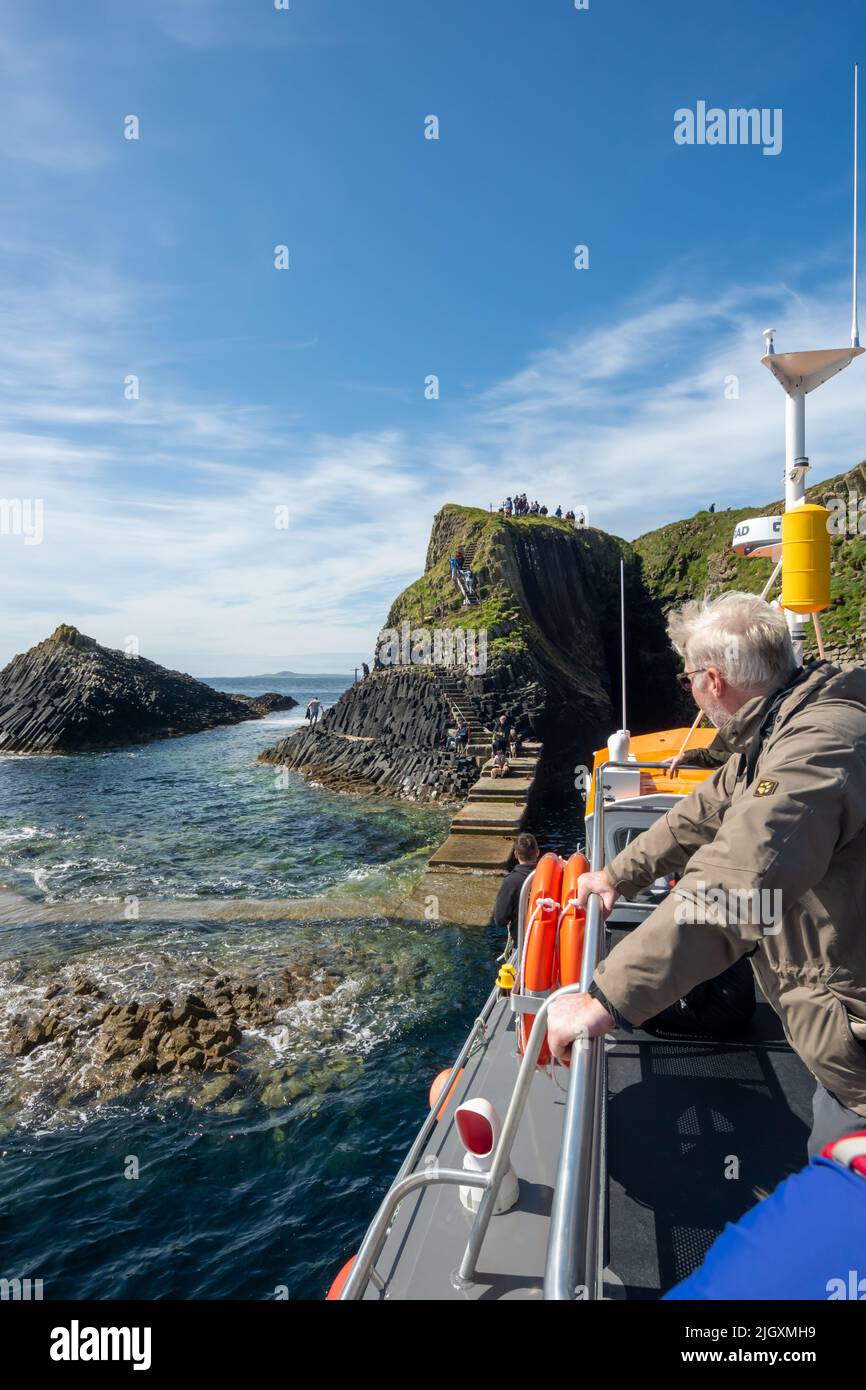 Staffa tours boat landing on the coast of Staffa, Scotland, UK Stock ...