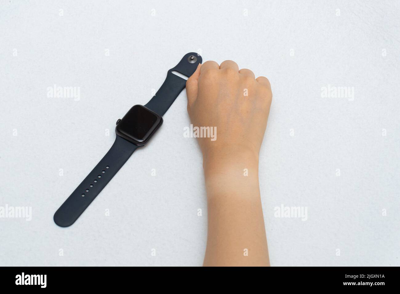 Watch marks on a woman's hand burned in the sun Stock Photo - Alamy