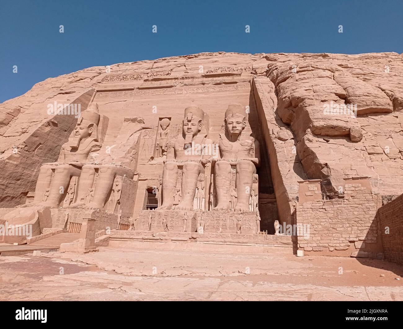 Abu Simbel, an ancient tomb carved on the stone with statues in Egypt ...