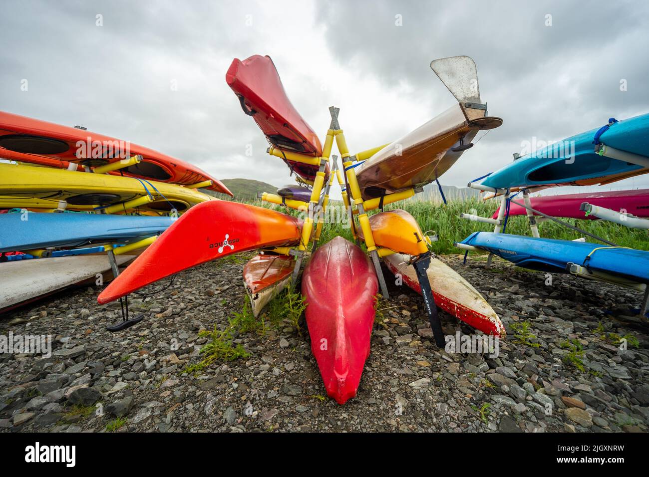 Colourful kayaks on the shore at Kilchoan Jetty, Scotland, UK Stock ...
