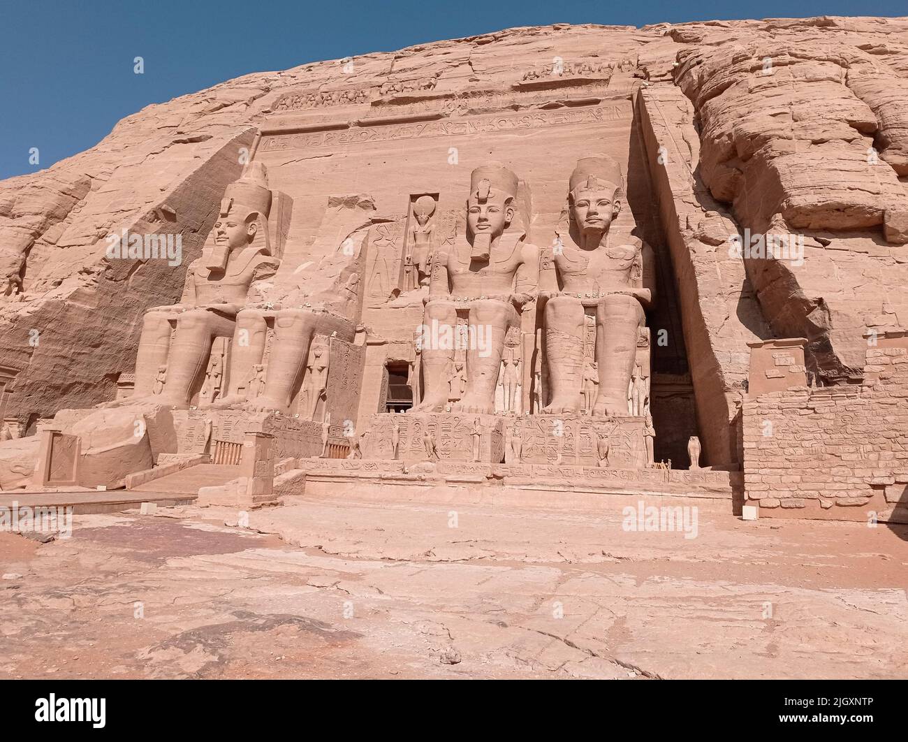 Abu Simbel, an ancient tomb carved on the stone with statues in Egypt ...