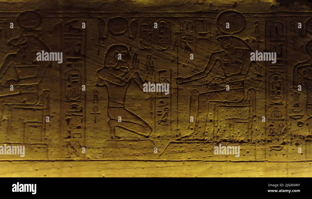 Detail of the hieroglyphs carved on the stone of an ancient wall in ...