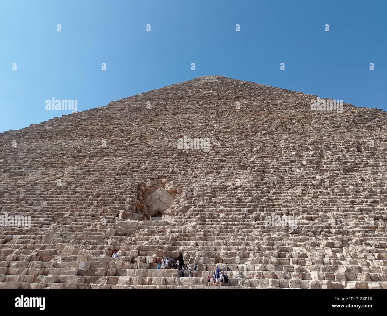 Tourists climbing the great pyramid of Giza in Egypt, Africa Stock ...