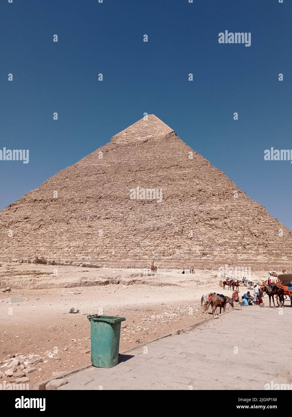 Ancient Pyramid in the middle of the desert with local people and ...