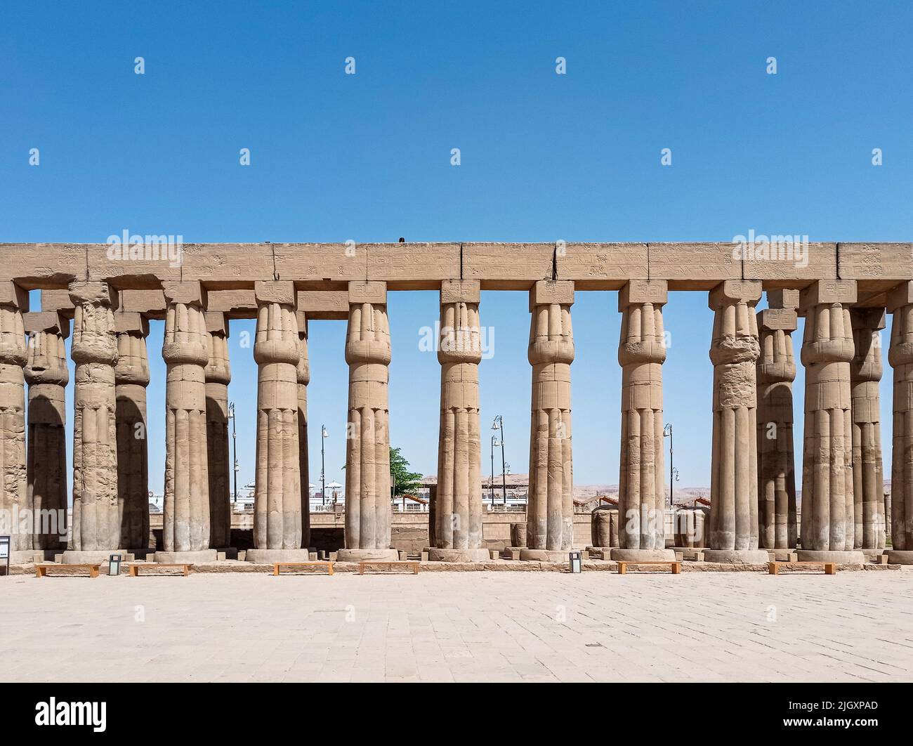 Ruins of an ancient egyptian temple with columns full of hieroglyphs in ...