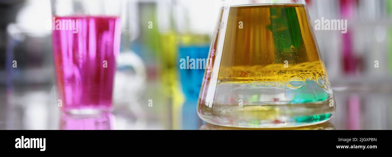 Glass flasks filled with different colours liquids for further ...