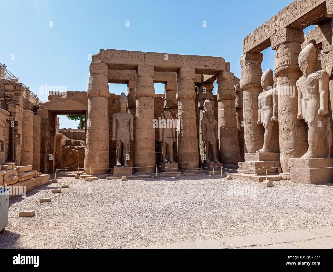 Ruins of an ancient egyptian temple with columns full of hieroglyphs in ...
