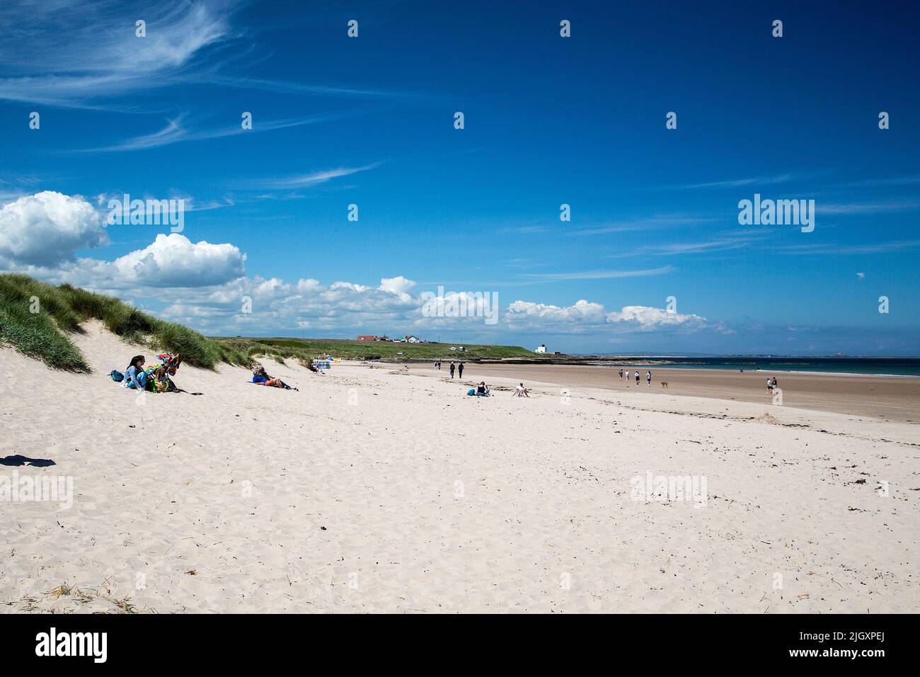 The beach at Bamburgh Castle, Bamburgh, Northumberland, UK ,on a bright ...