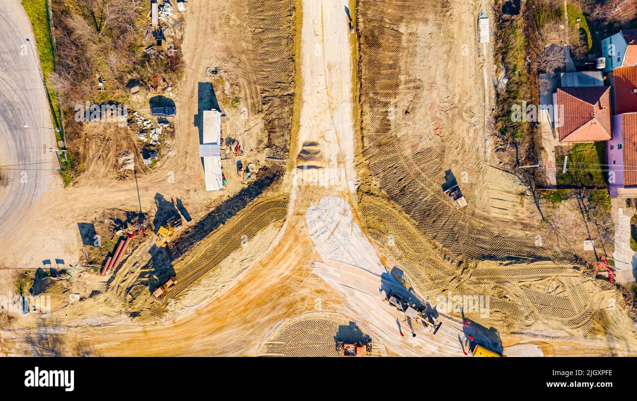 Above top view on active traffic, building site with workers and ...