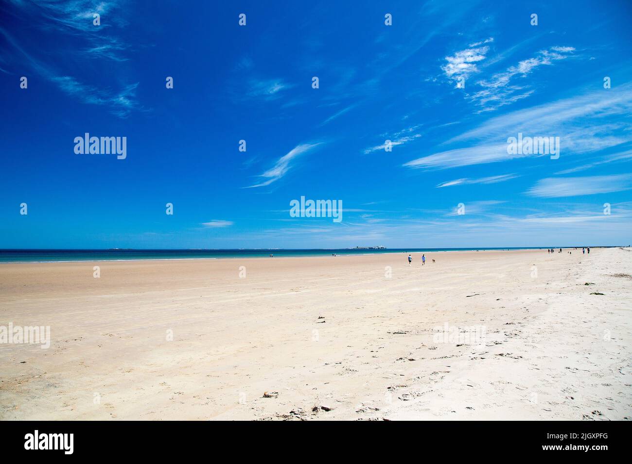 The beach at Bamburgh Castle, Bamburgh, Northumberland, UK ,on a bright ...