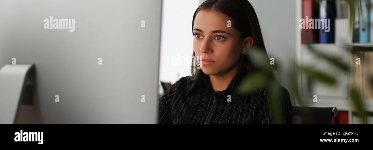 Young office worker stare at computer screen, search information online ...