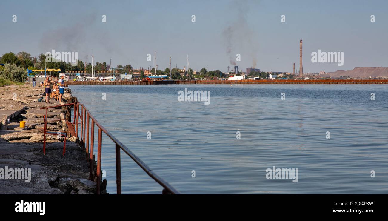 Mariupol, Ukraine - July 15, 2021: Fishermen on the embankment of the ...