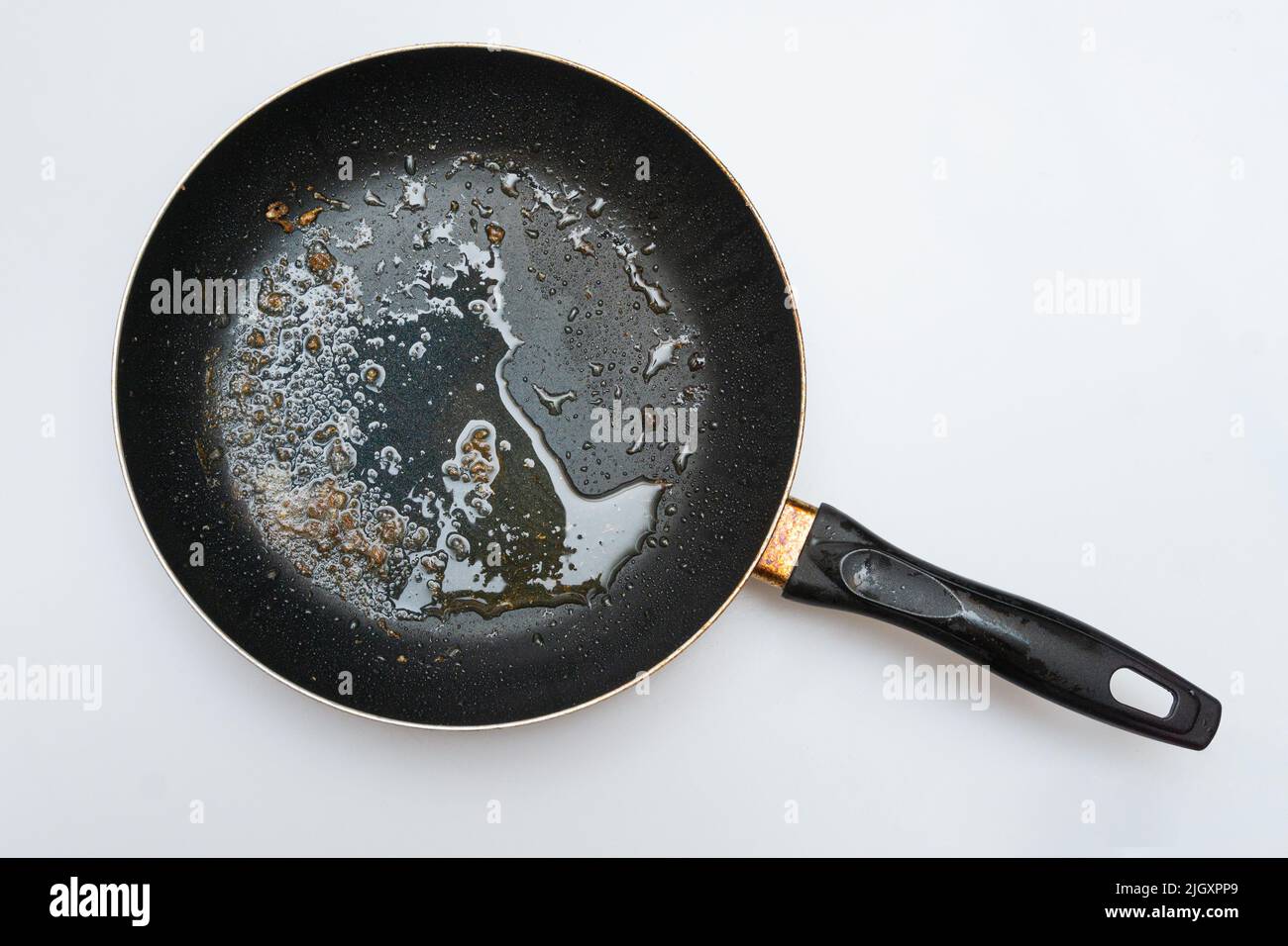 Old frying pan with a lot of grease Stock Photo - Alamy