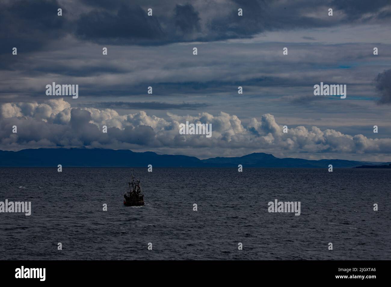 Boats against a moody sky, The Minch, Scotland Stock Photo - Alamy