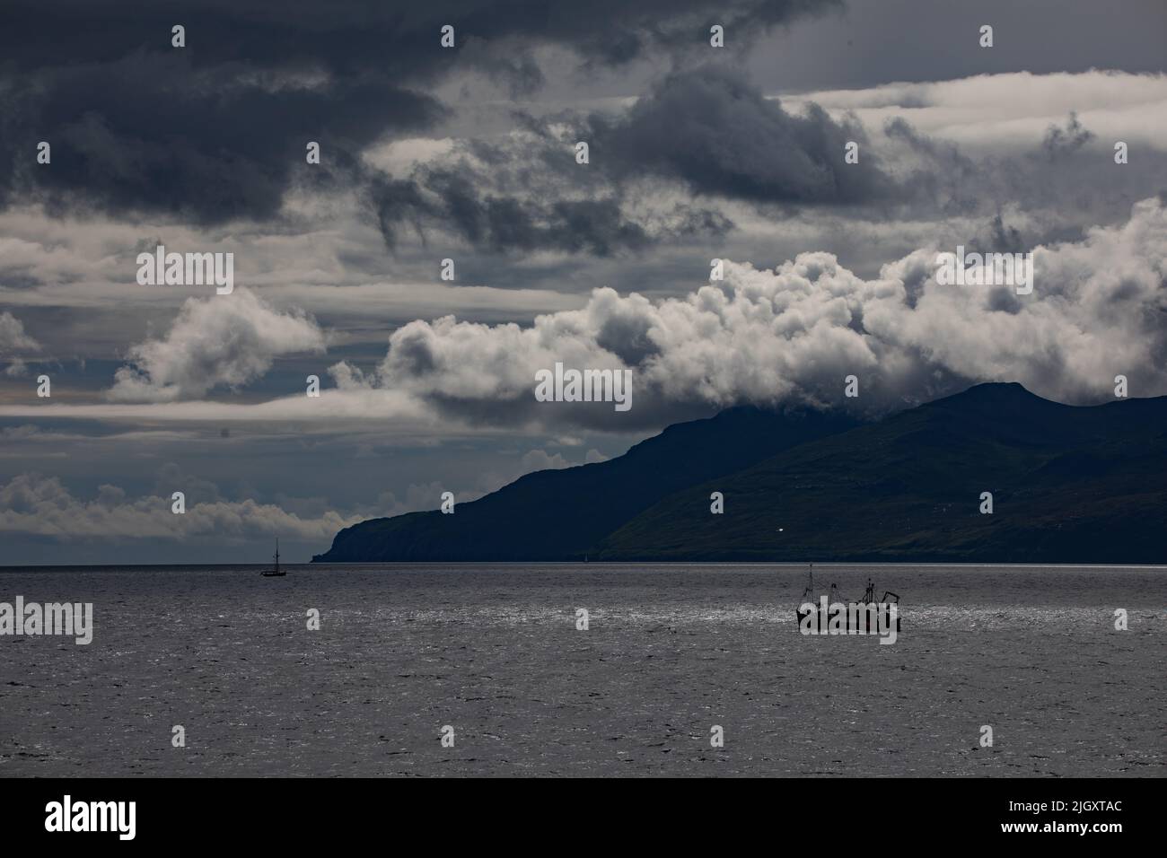 Boats against a moody sky, The Minch, Scotland Stock Photo - Alamy