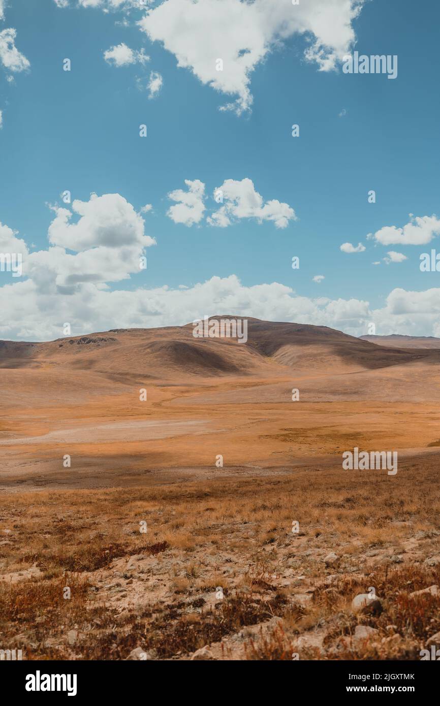 beautiful orange valley with hills on sunny day in Deosai National Park ...